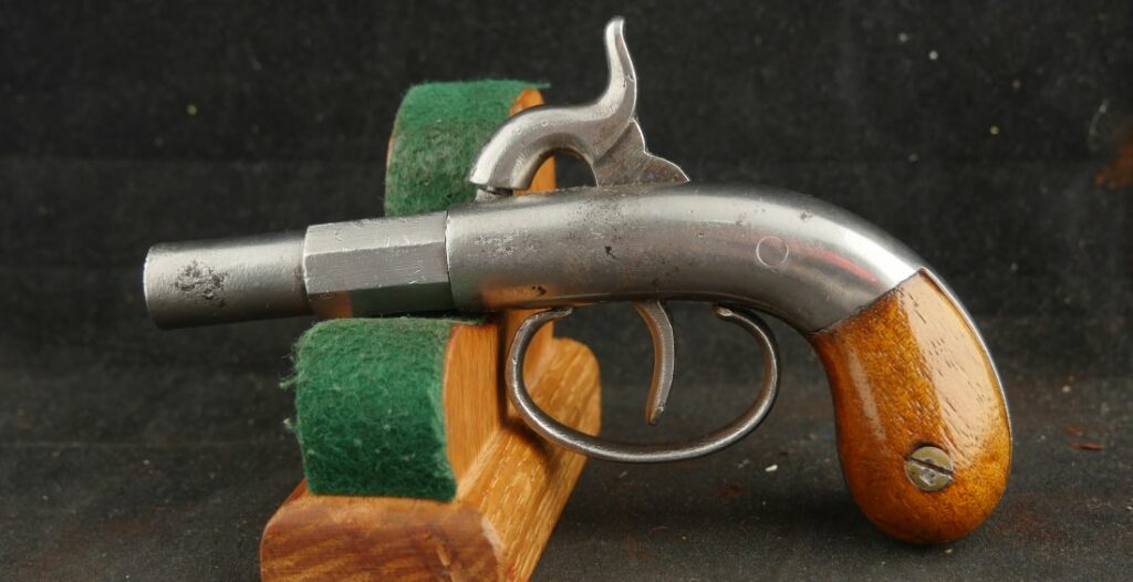 079-0324-7141, Continental Muff Pistol in display case. BLOWOUT ...